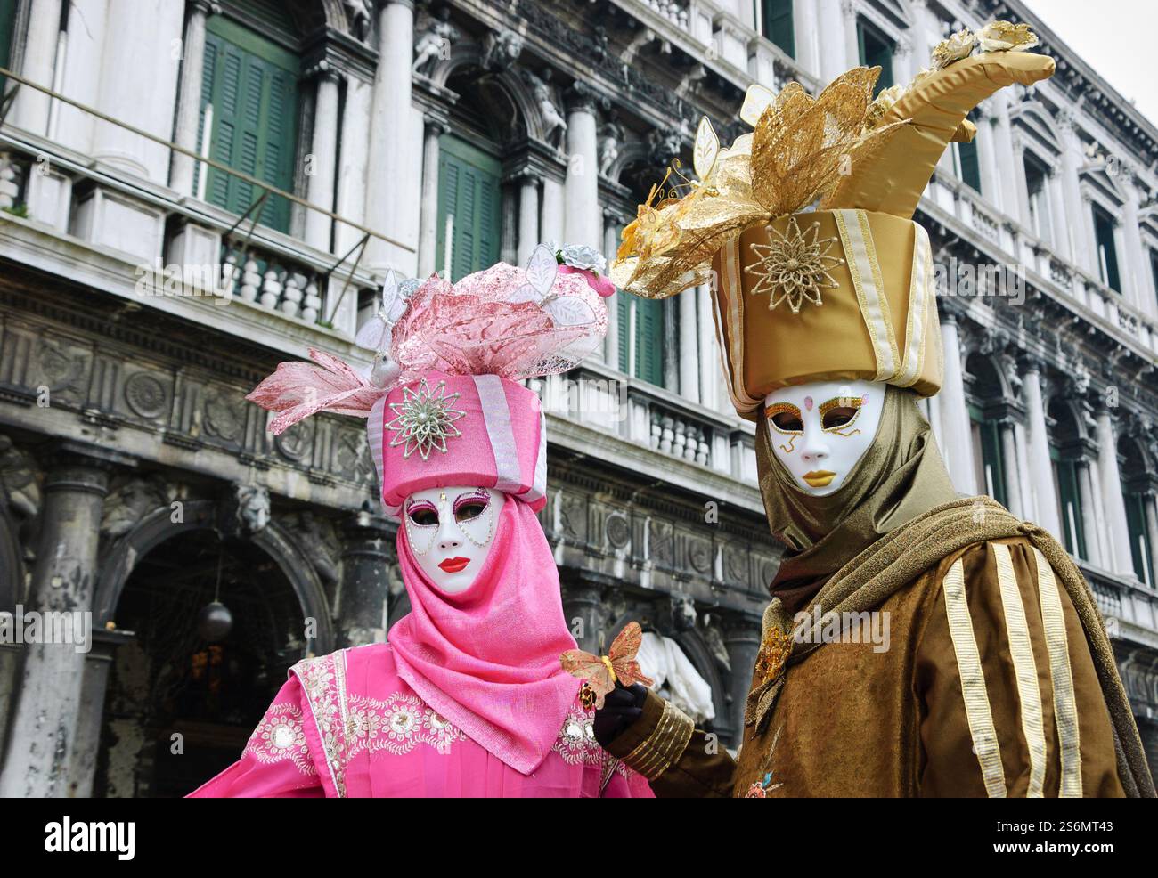 Noble couple masks in costumes decorated with flowers, butterflies and ...