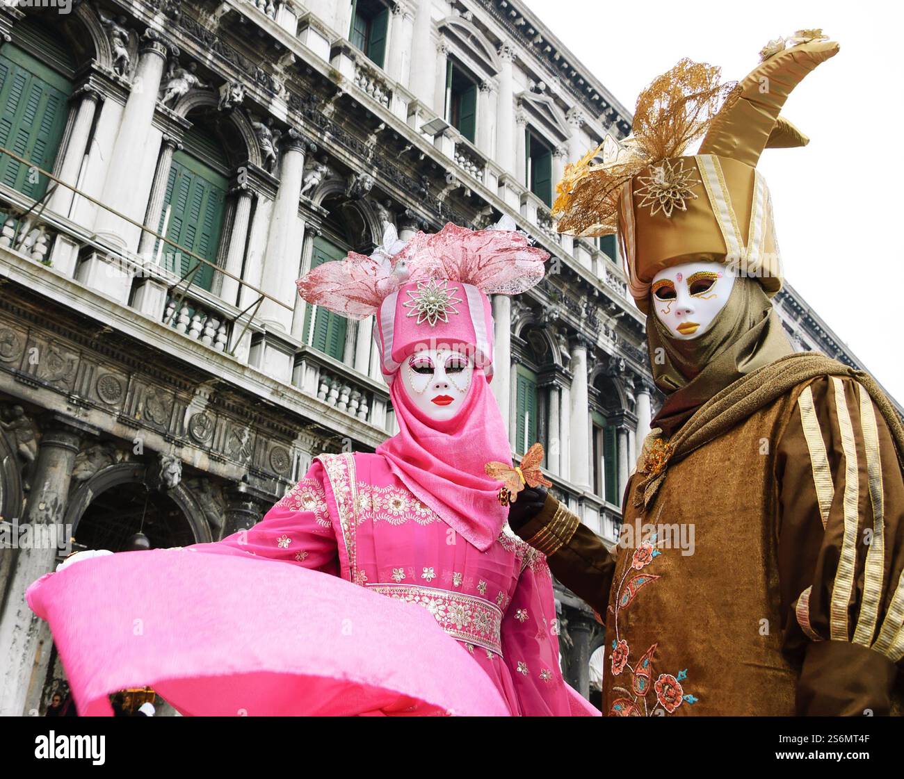 Noble couple masks in costumes decorated with flowers, butterflies and ...
