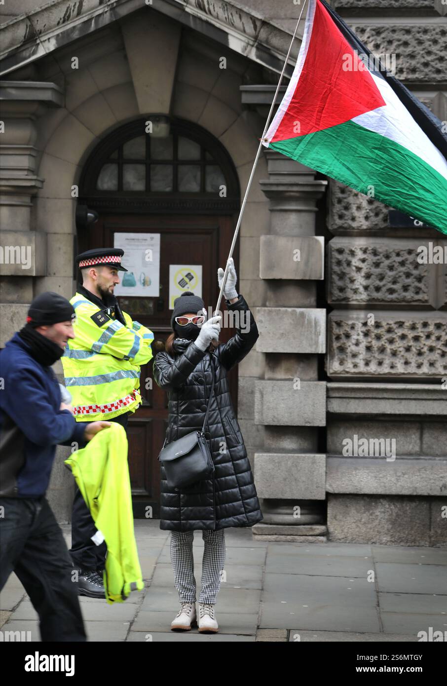London, England, UK. 17th Jan, 2025. A supporter holds a Palestinian ...