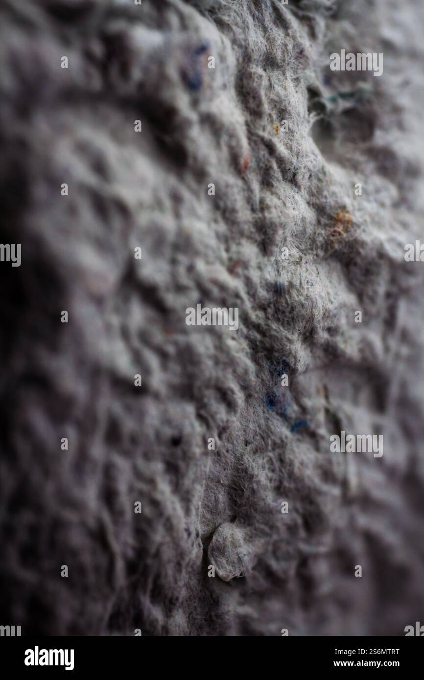 Extreme close up of old gray handmade paper clay with a structure and ...