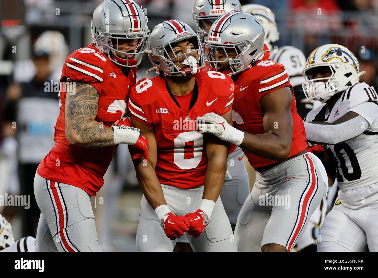 FILE - Ohio State linebacker Cody Simon (0) celebrates with teammates ...