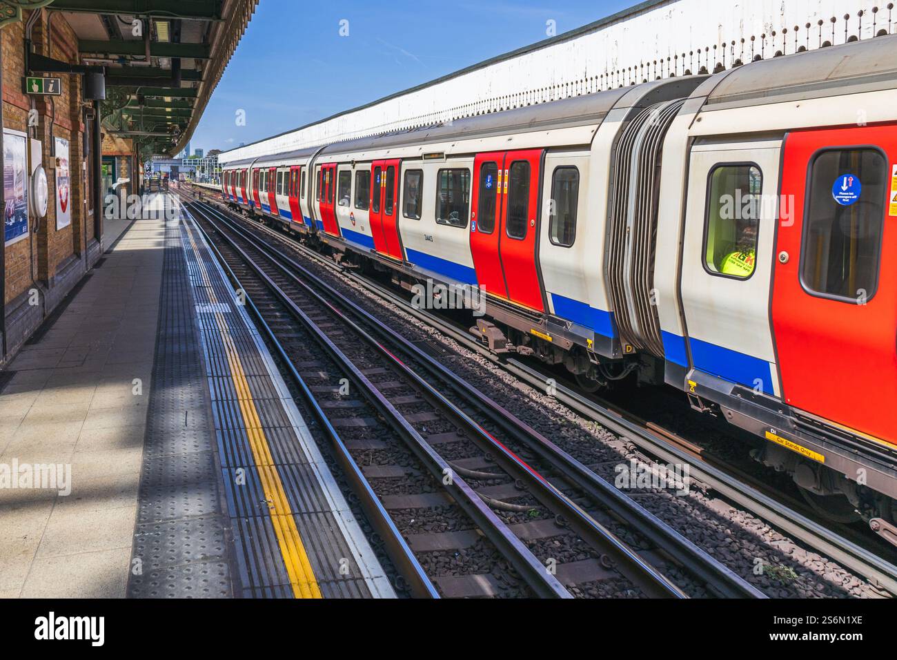 London Underground Train Arriving at Station Stock Photo - Alamy