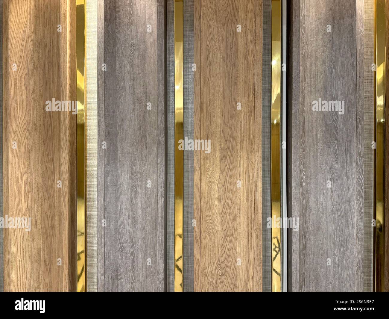 Series of curved moulded wood panel texture with golden tinted mirrors ...