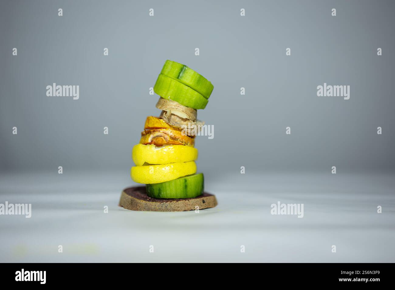 Stacked Slices of Fresh Turmeric, Beetroot, Lemon, Cucumber, and Ginger ...