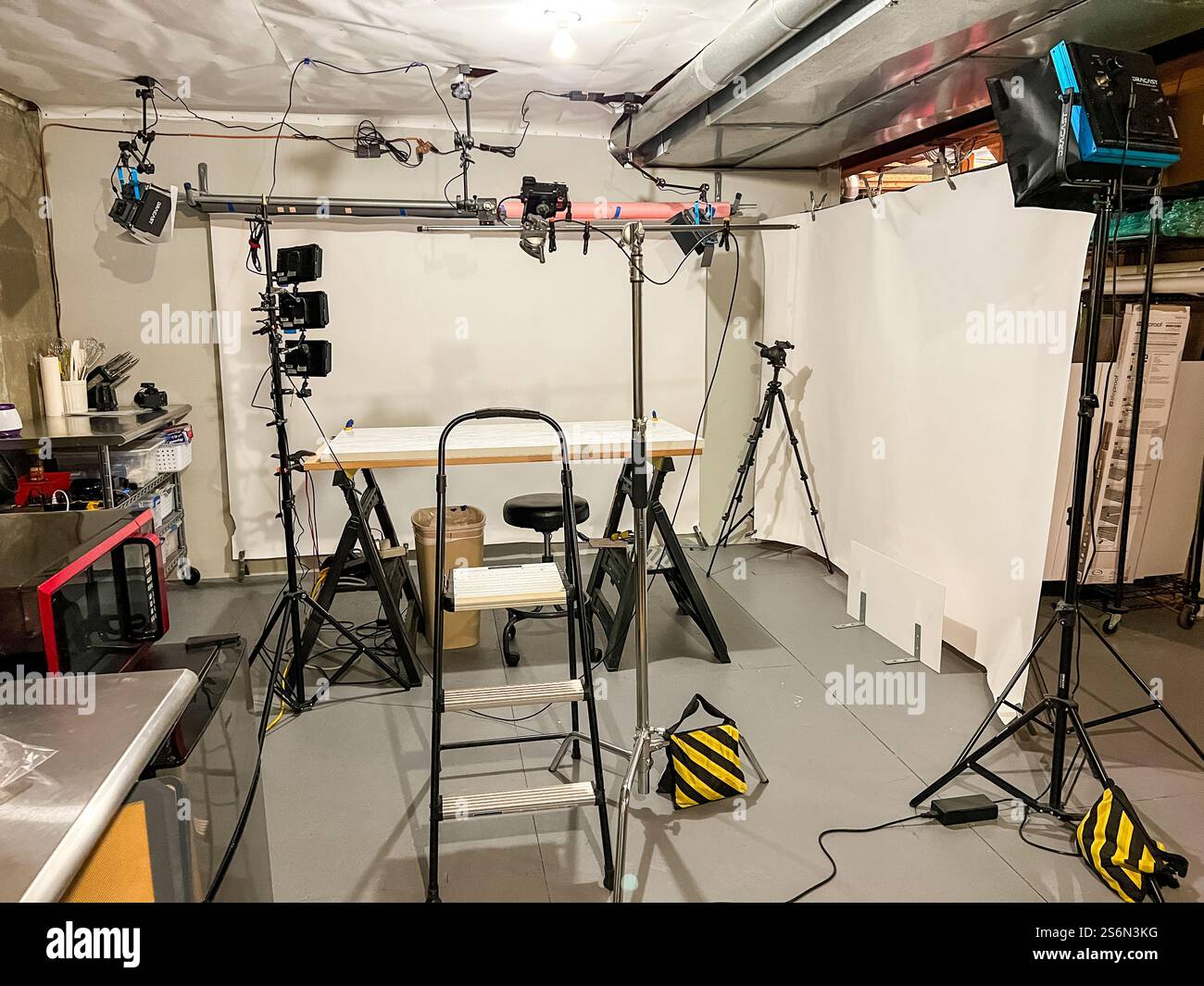 Basement Photography Setup with Lighting Equipment Stock Photo - Alamy