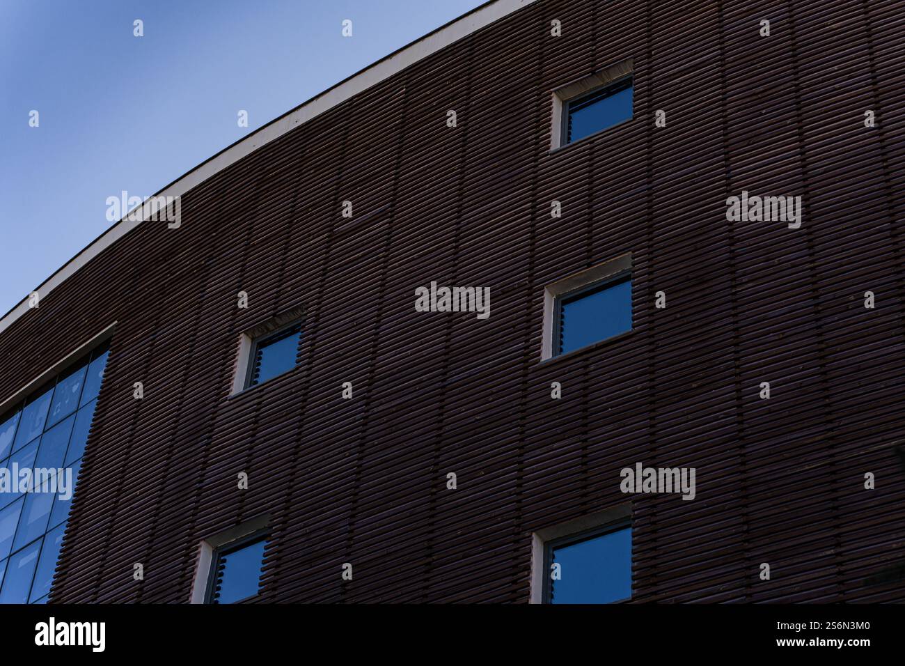 House covered with wooden panels and windows Stock Photo - Alamy
