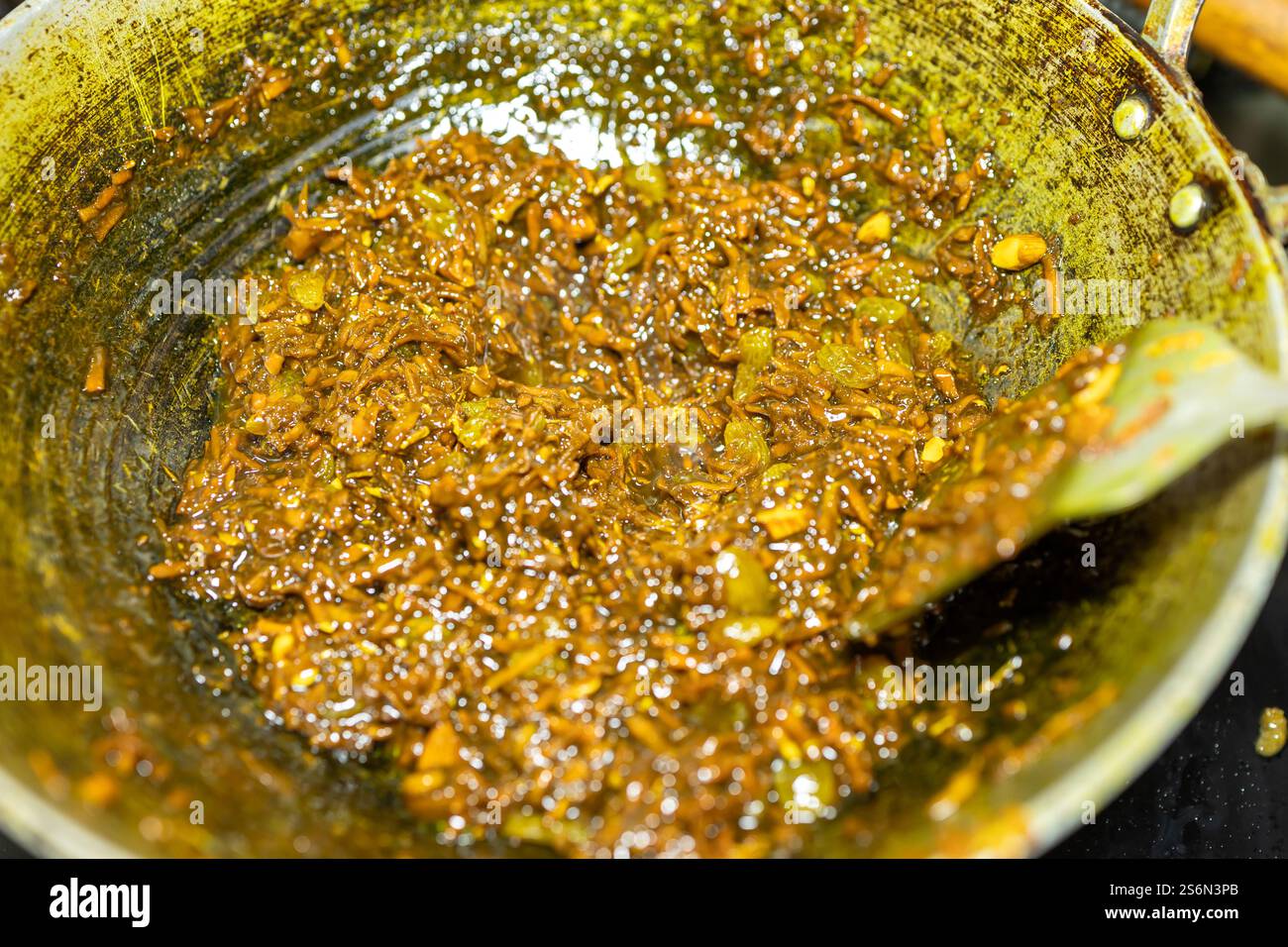 cooking and roasting of Freshly Grated Turmeric in pan Close-Up Studio ...