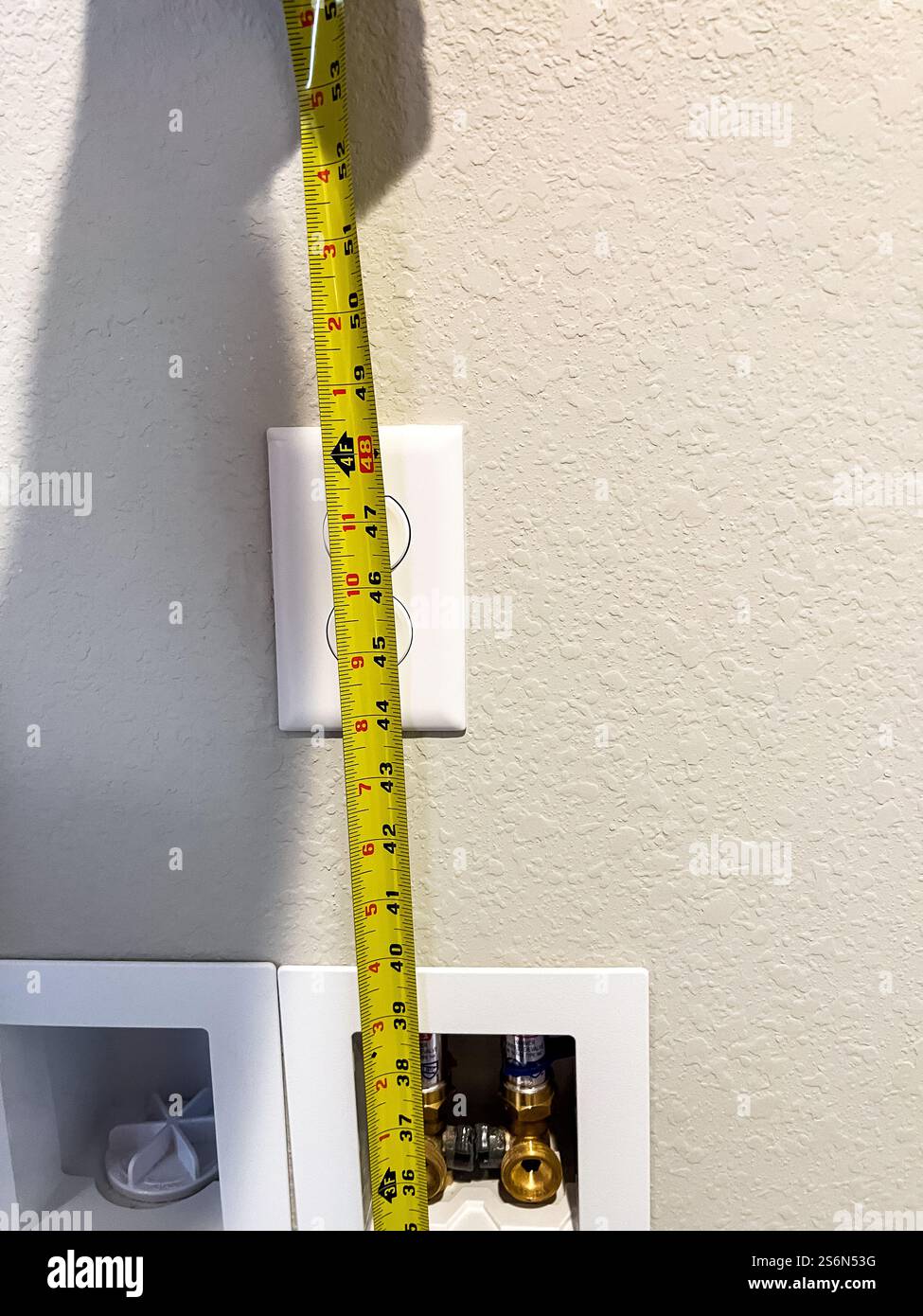 Laundry Room Utility Hookups and Outlet Stock Photo - Alamy