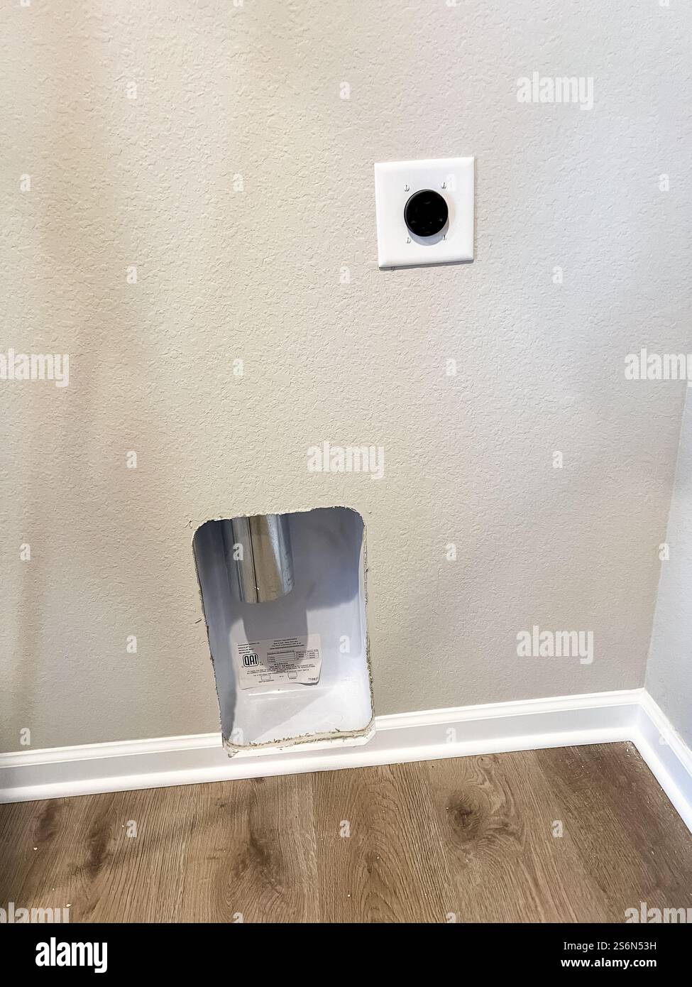 Laundry Room Utility Hookups and Outlet Stock Photo - Alamy