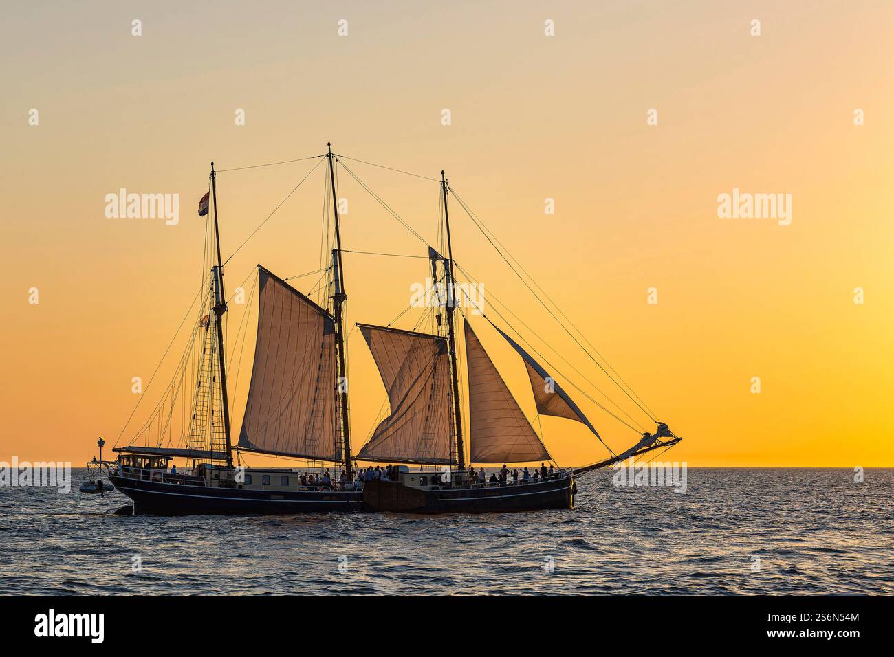 Sailing ship at sunset during the Hanse Sail in Rostock Stock Photo - Alamy