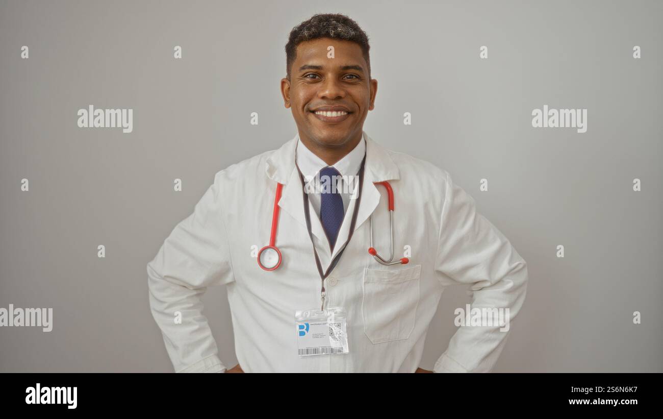 Smiling male hispanic doctor in white coat with stethoscope poses ...