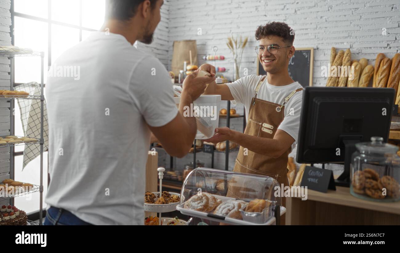 Smiling baker serving a customer in a cozy bakery shop filled with ...