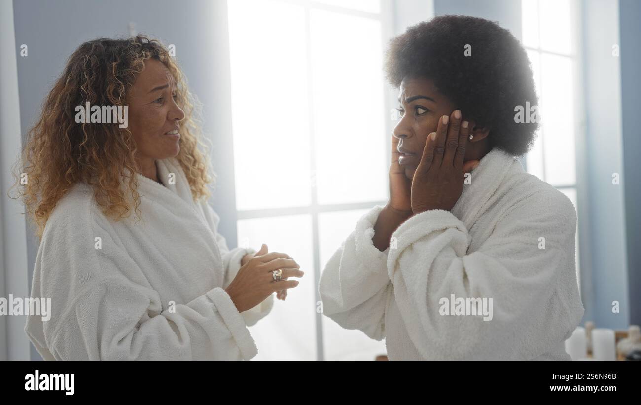 Women wearing robes and enjoying a relaxing moment together in a bright ...
