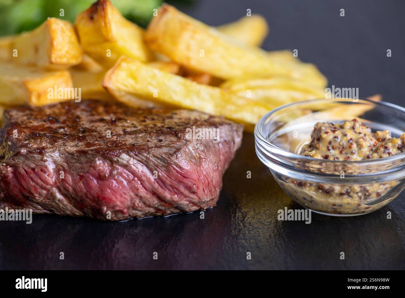 Steak with chips on slate Stock Photo - Alamy