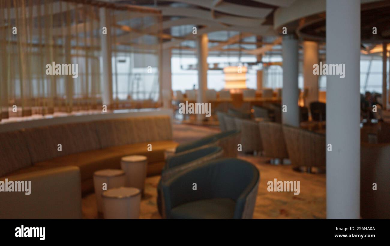 Blurry luxury restaurant interior with elegant seating and ambient ...