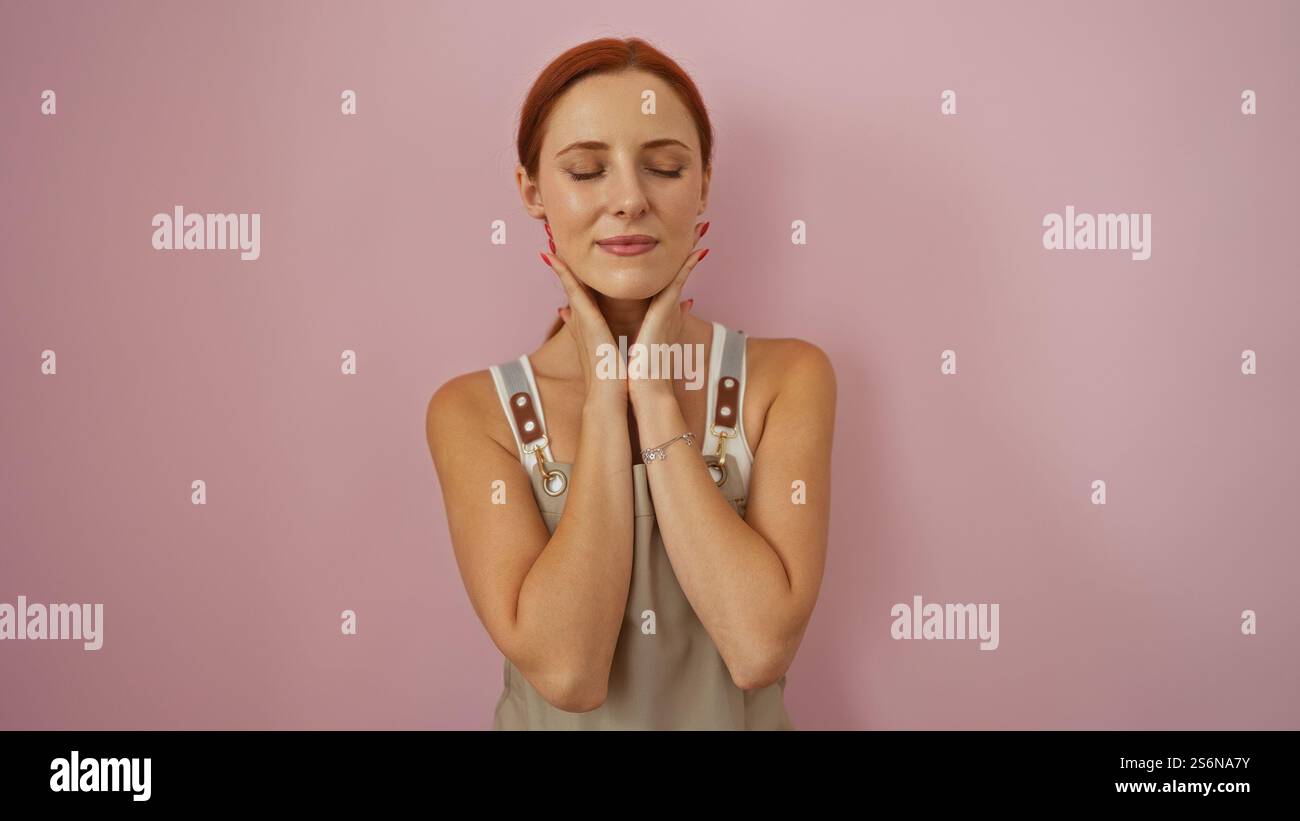 Redhead woman feeling relaxed with closed eyes over isolated pink ...