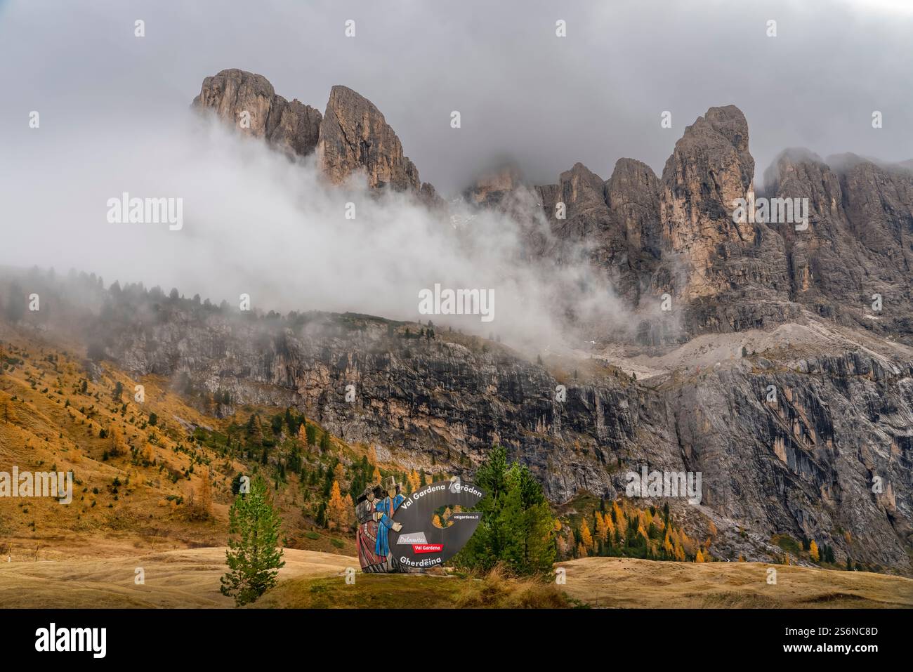 Mountains, low hanging clouds and fall foliage color and the Val ...