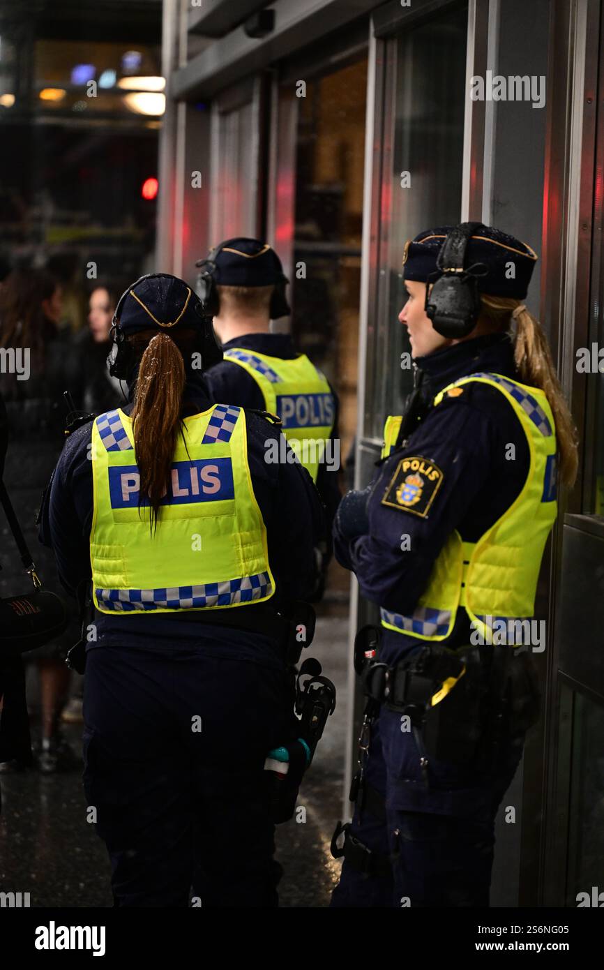 Stockholm, Uppland, Sweden. January 1 2025. Police and security guards ...
