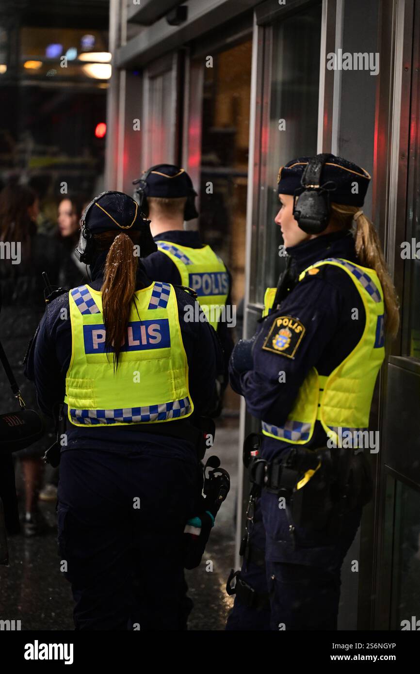 Stockholm, Uppland, Sweden. January 1 2025. Police and security guards ...