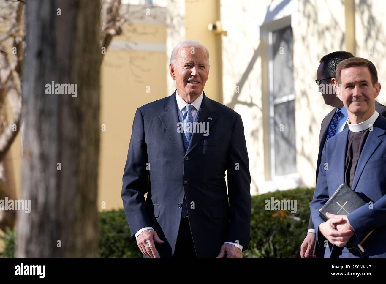 President Joe Biden smiles as he walks out of St. John's Church in ...