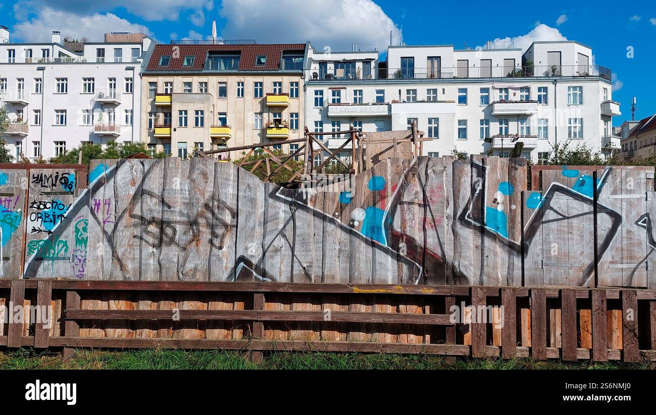 House font behind board fence with graffiti in Berlin Stock Photo - Alamy