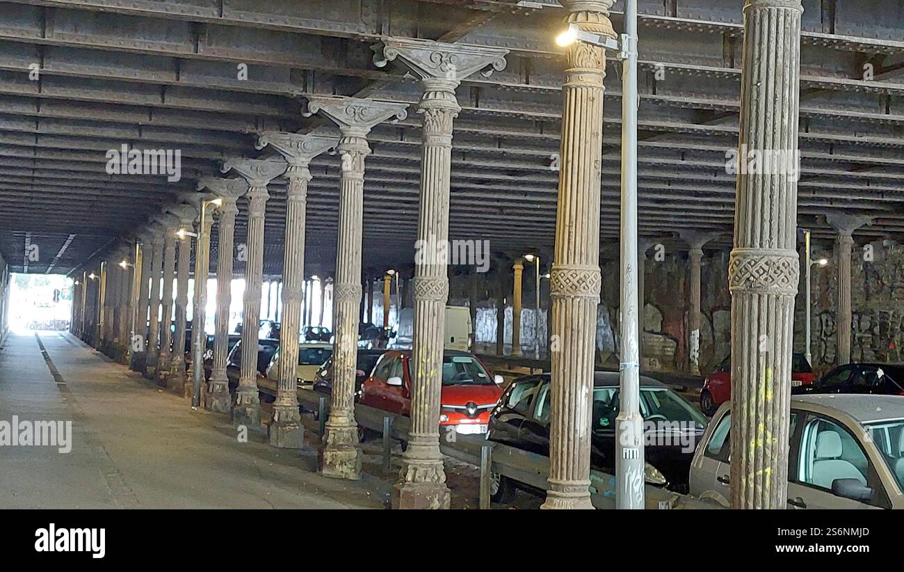 Underpass with steel bridge and cast-iron columns Stock Photo - Alamy