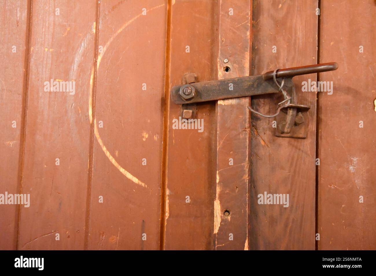 Simple bolt closes wooden door Stock Photo - Alamy