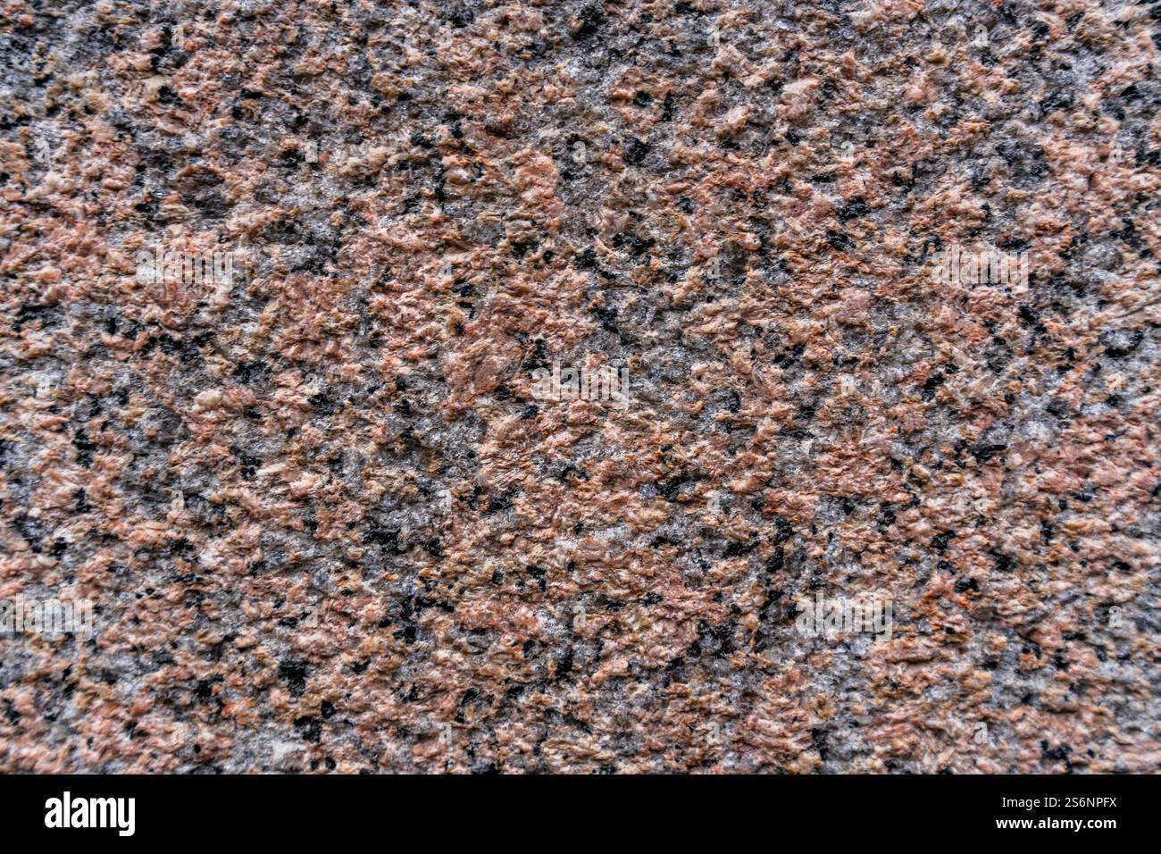 A close up of a stone wall with a lot of texture. The wall is made of ...