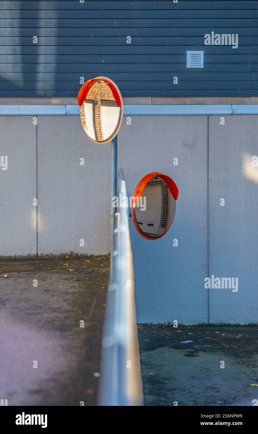 Two mirrors providing visibility around corners for car drivers Stock ...
