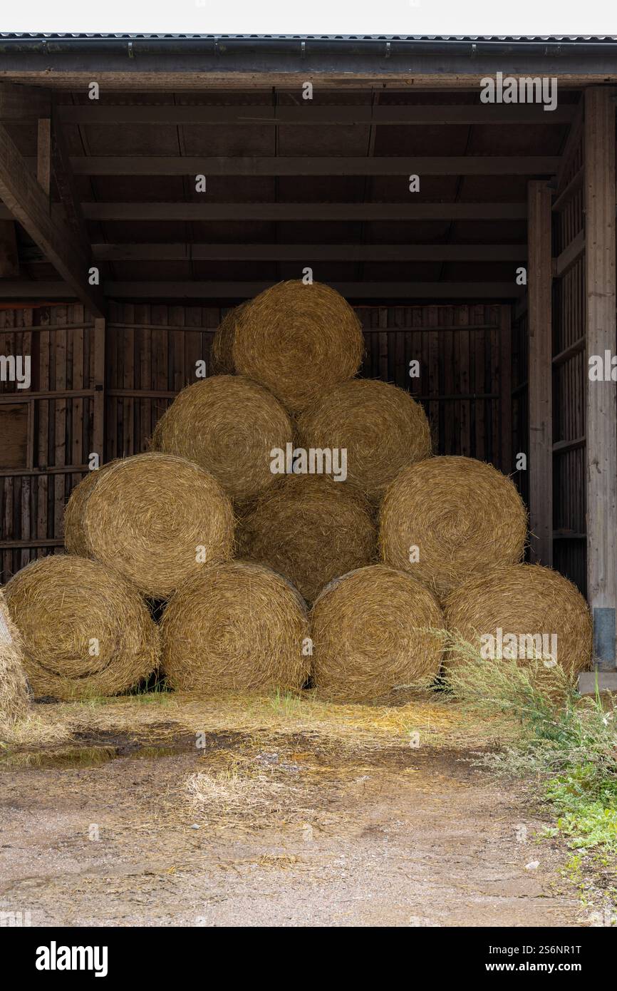 Pyramid of hay bales in a barn Stock Photo - Alamy