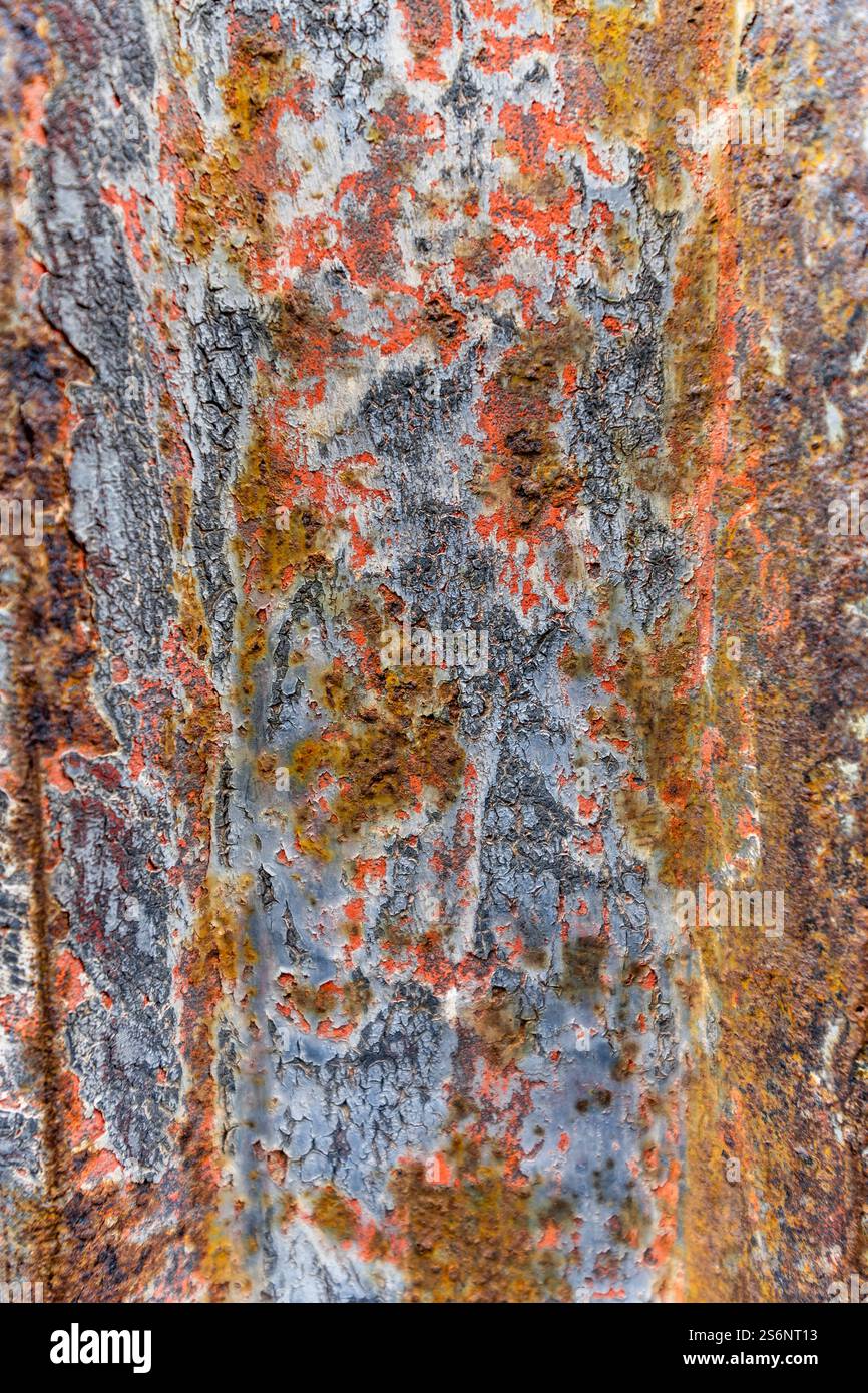 The image is of a rusty metal object with a lot of texture and color ...
