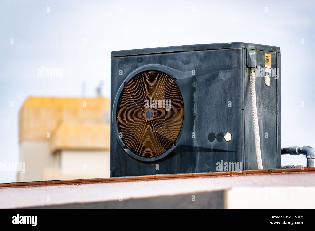 A black air conditioner unit with a fan on top Stock Photo - Alamy
