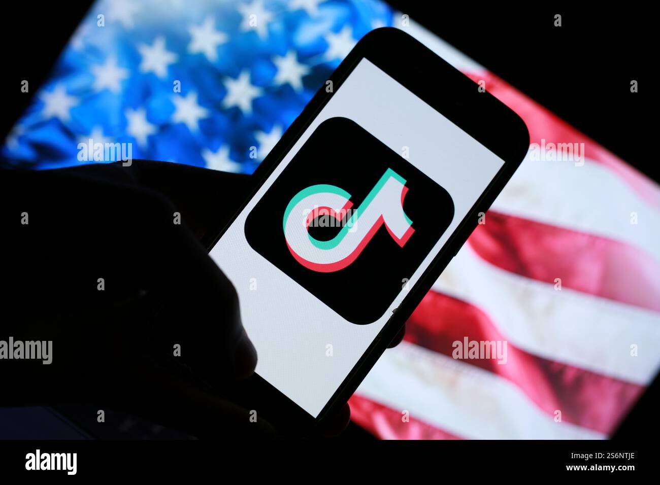 London, UK. 17 January 2025. The TikTok logo is displayed on a mobile phone against the ...