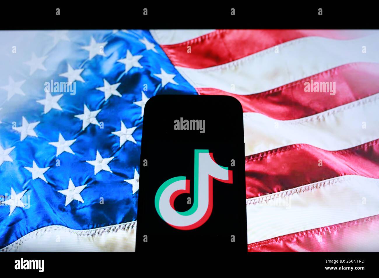 London, UK. 17 January 2025. The TikTok logo is displayed on a mobile phone against the ...