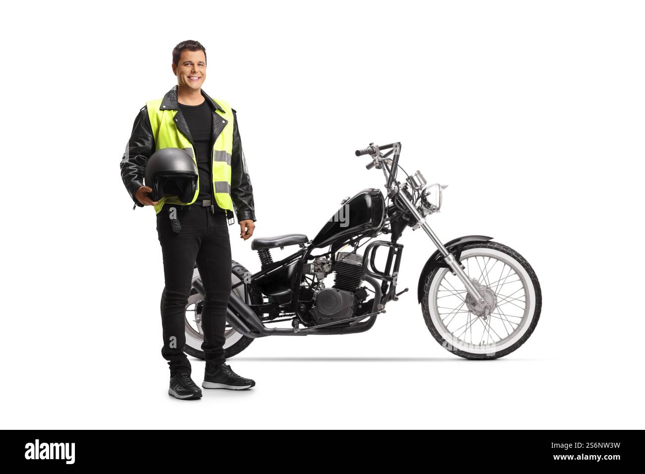 Biker holding a helmet and wearing a traffic safety vest isolated on ...