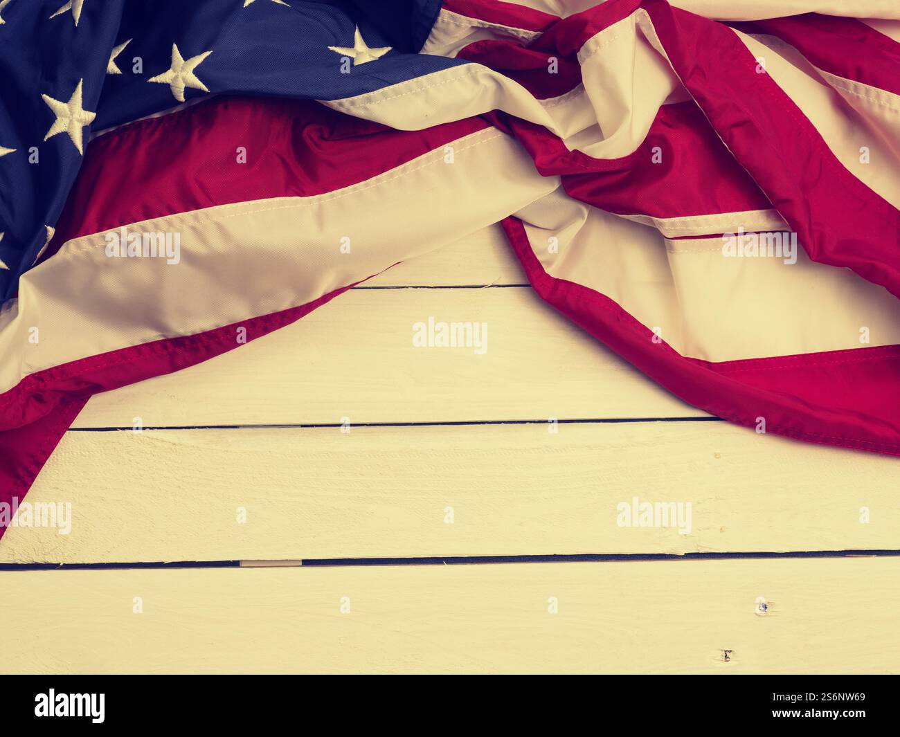 The flag of the United States of America on rustic white barn wood ...