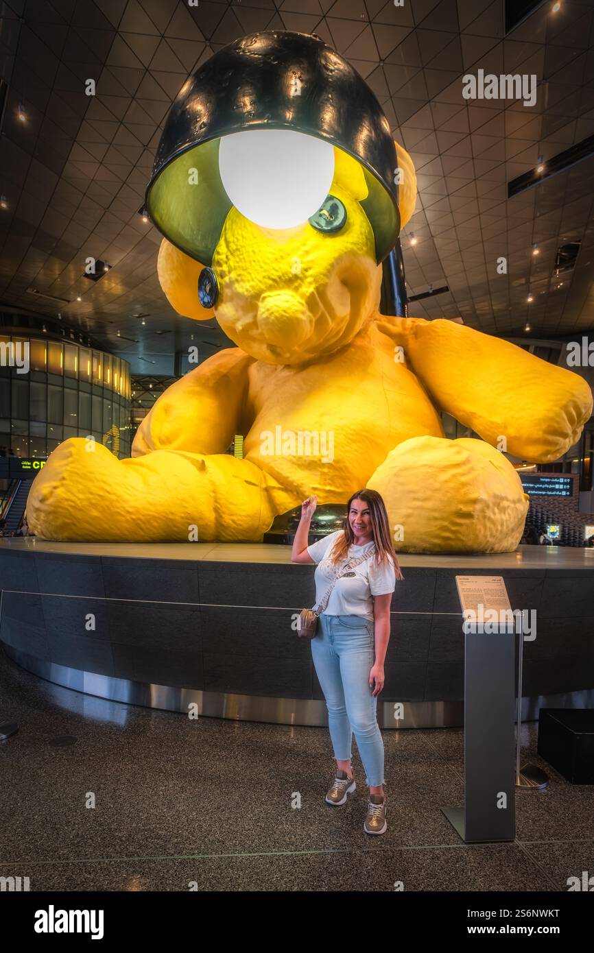 Doha, Qatar, 27 Sep 2024 A delighted visitor poses alongside a massive ...