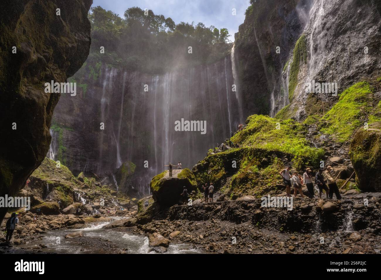 Java, Indonesia, 3 Oct 2024 A stunning waterfall cascades down rugged ...