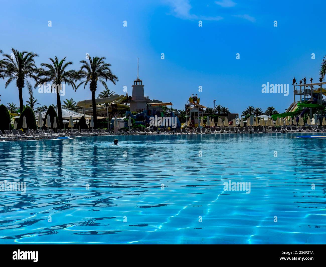 View of the pool of the hotel complex with palm trees, Lara Beach ...