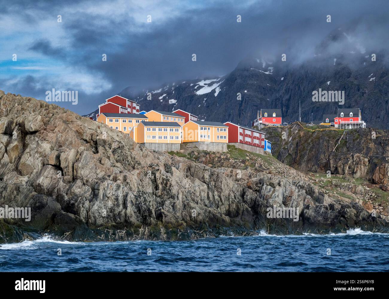 Brightly colored houses perched on cliffs in Sisimiut showcase the ...