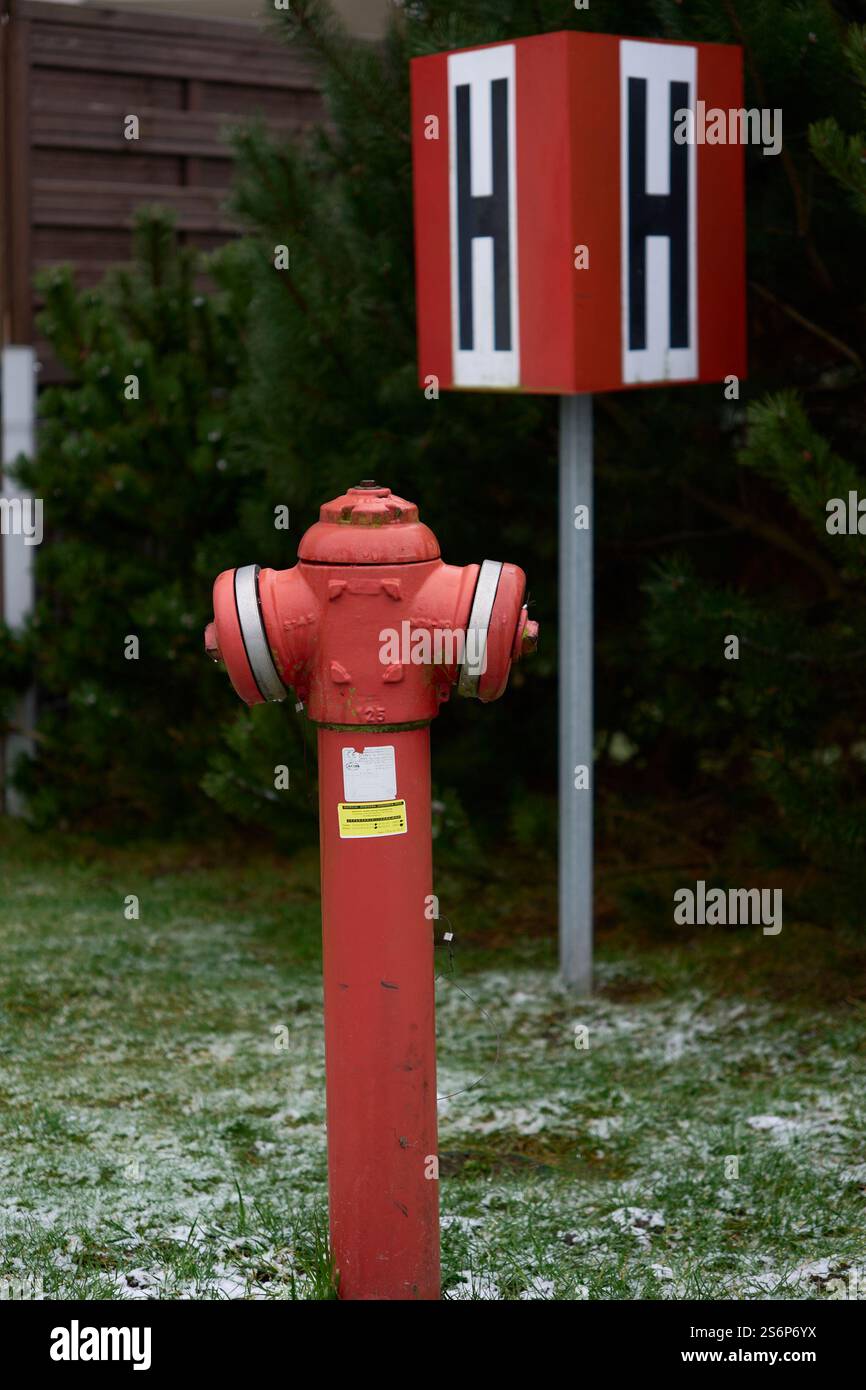 The Hydrant Marker and Fire Hydrant are both located within a lush area ...