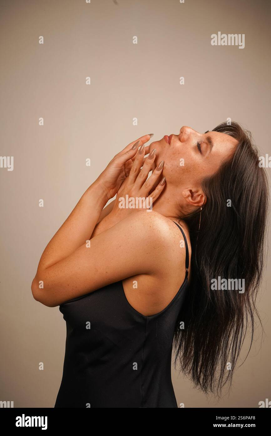 The woman's head is thrown back, and her long hair stretches to the ...