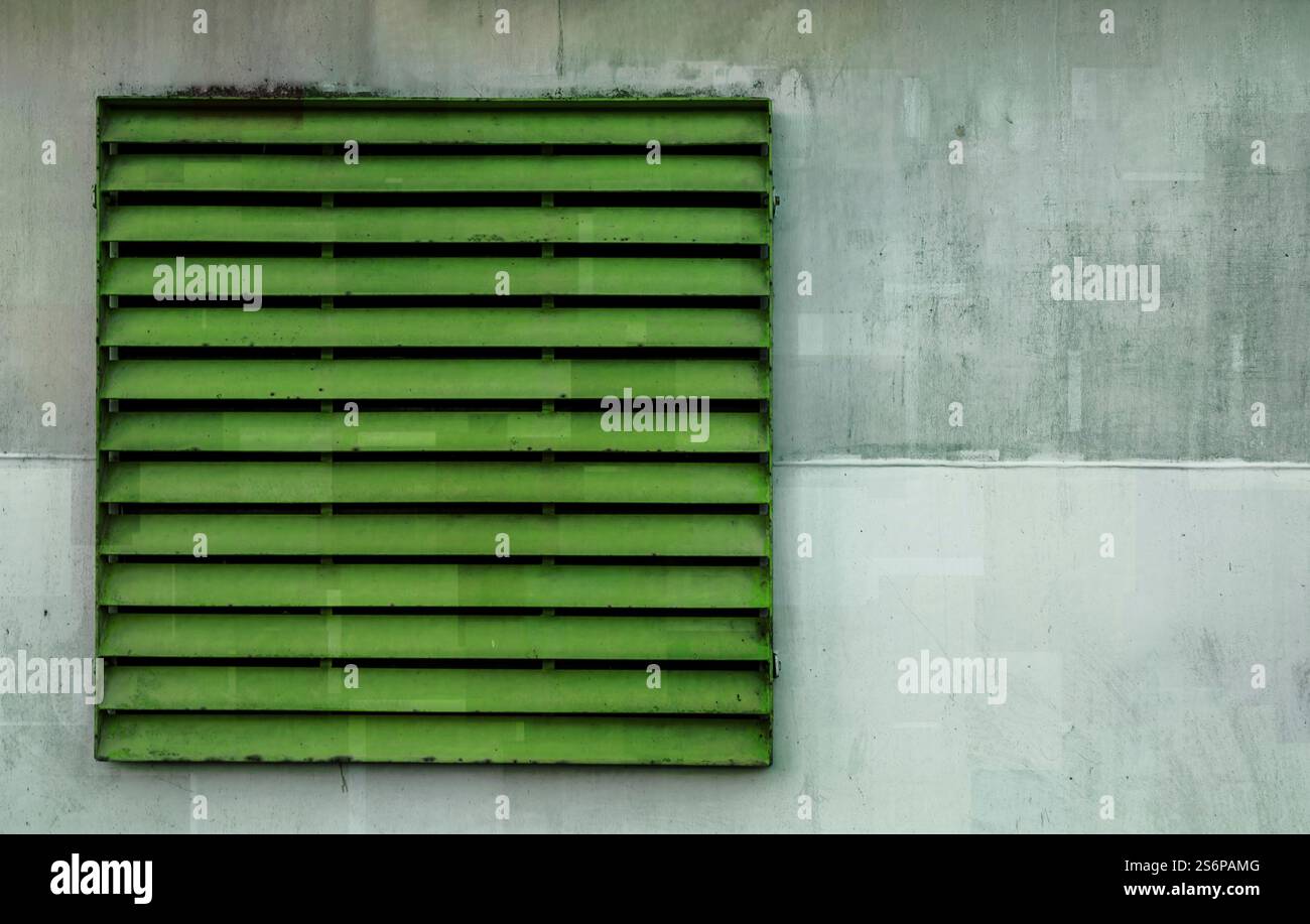 Green louvre window on a greenish facade Stock Photo - Alamy