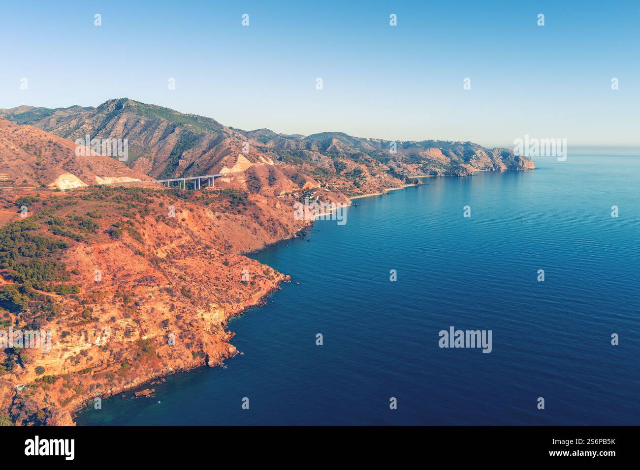 Rocky seashore with clear blue sky. Seascape in the evening. Aerial ...