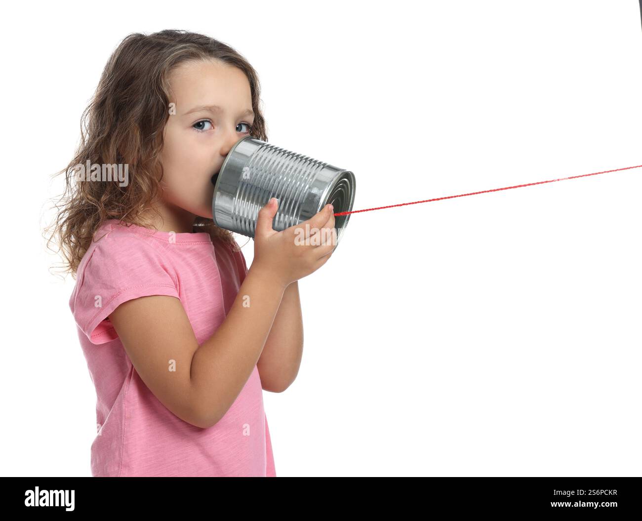 Girl using tin can telephone on white background Stock Photo - Alamy
