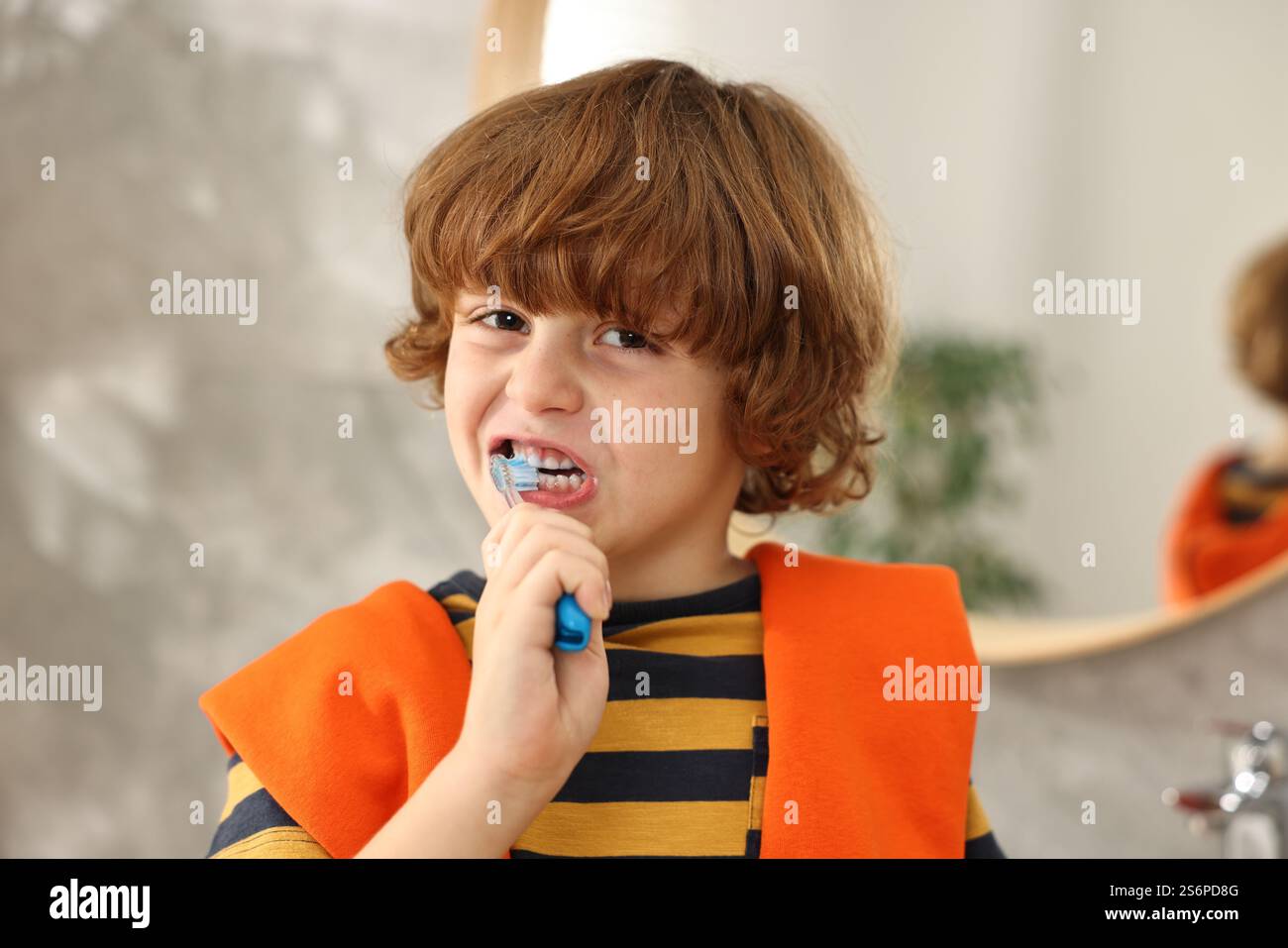Cute boy brushing his teeth at home Stock Photo - Alamy