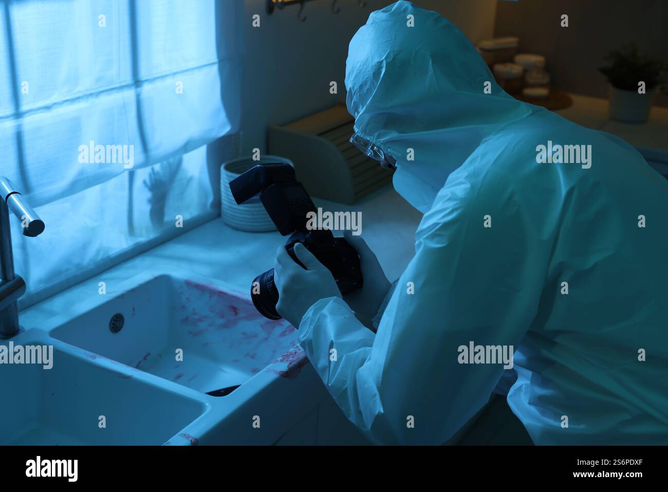 Forensic expert with camera working at crime scene indoors Stock Photo ...