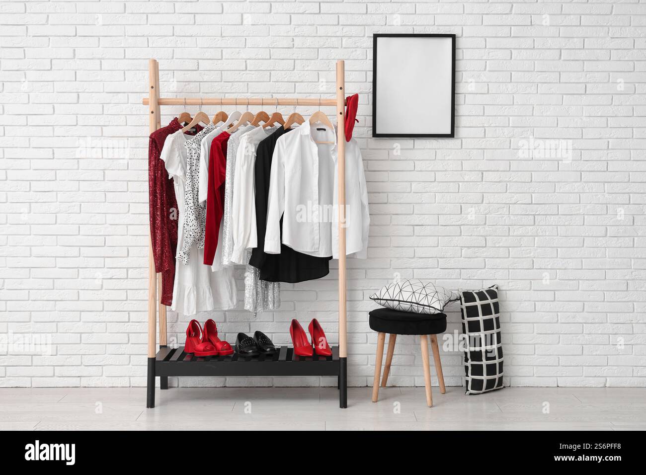 Interior of stylish dressing room with rack and pouf Stock Photo - Alamy