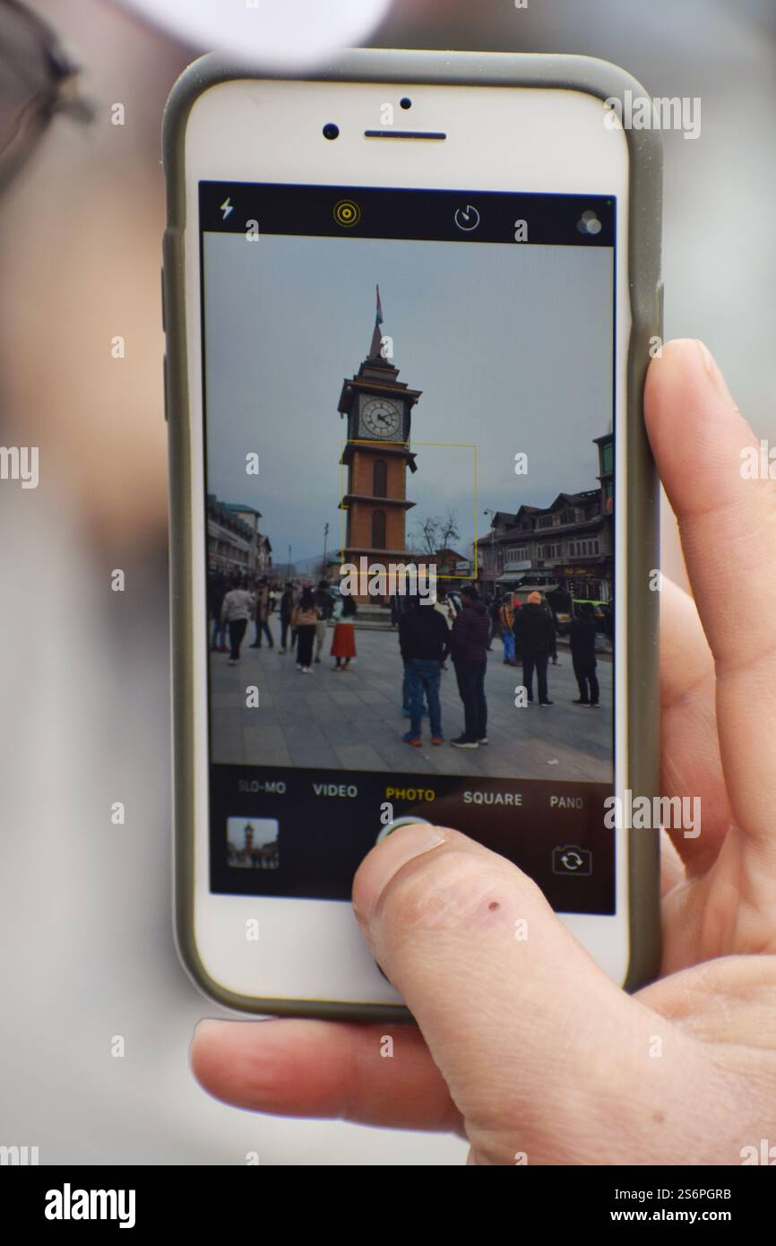 A person taking photo to the Iconic Clock Tower know as Ghanta Ghar and ...