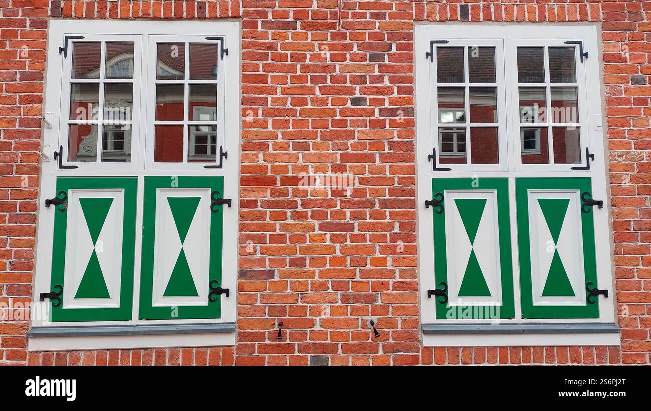 Georgian bar window with green and white casements in brick house Stock ...